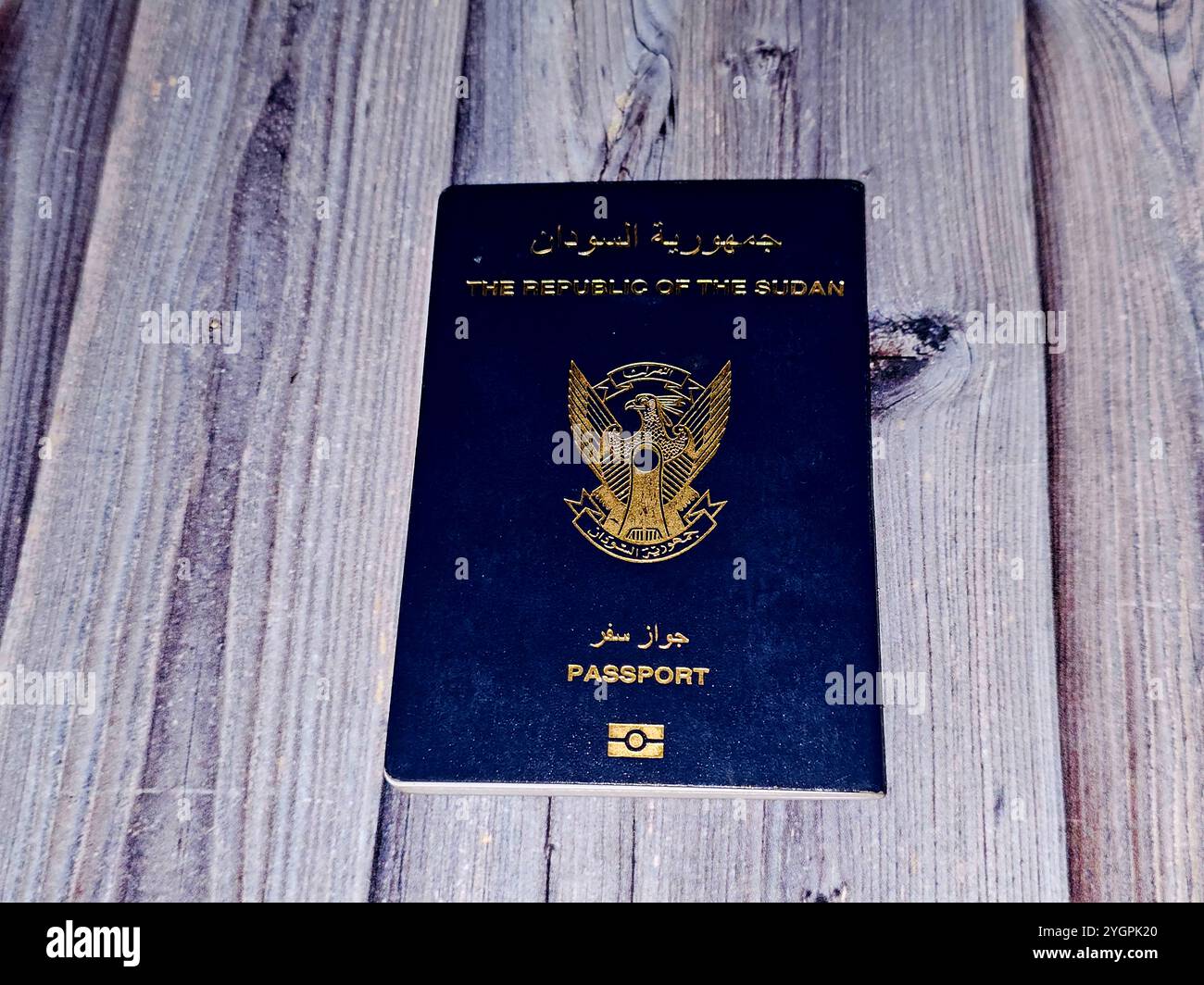 The Republic of Sudan passport with a gilded falcon in the center of ...