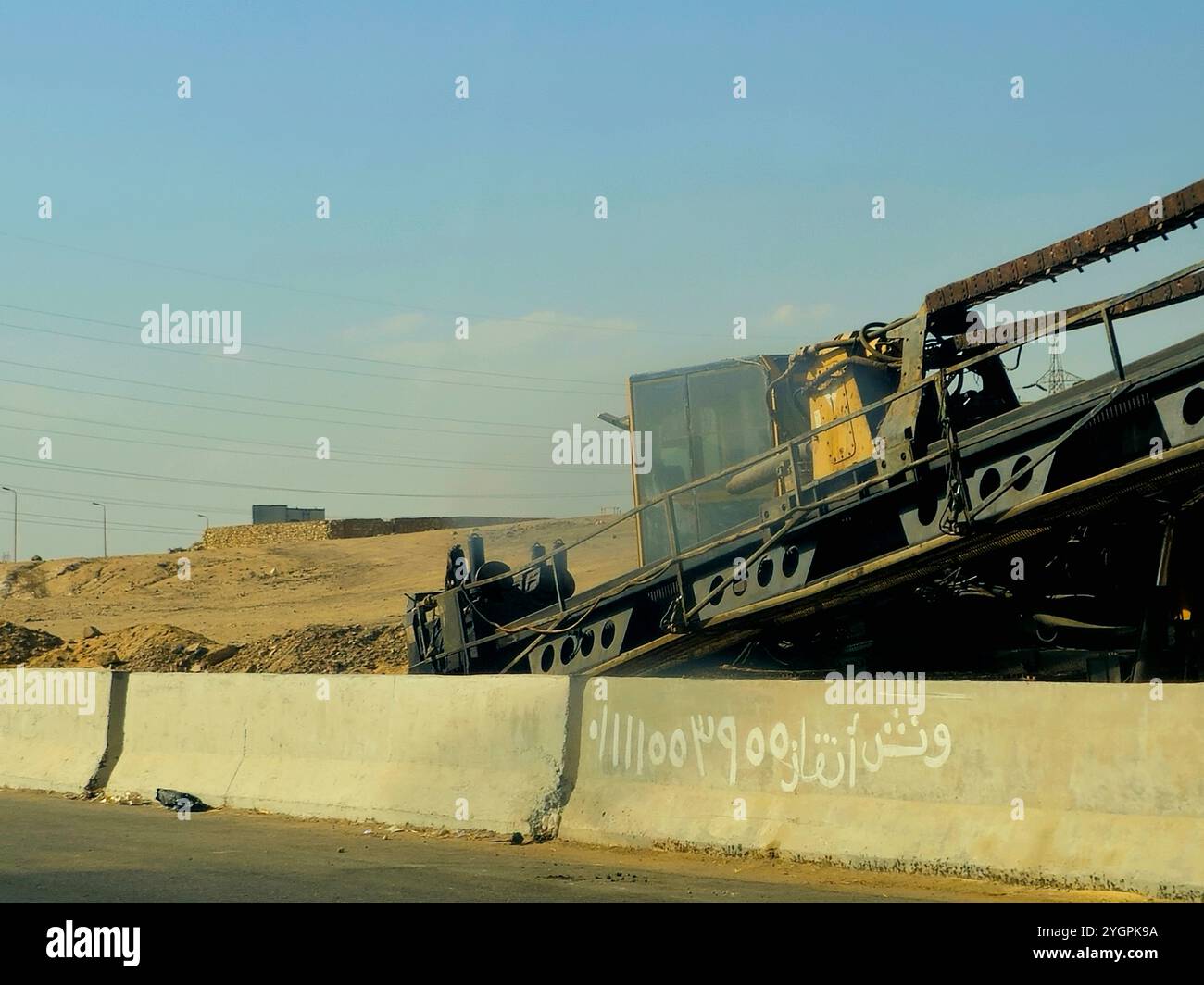 Giza, Egypt, October 25 2024: The heavy construction trucks for development near the road at the ...
