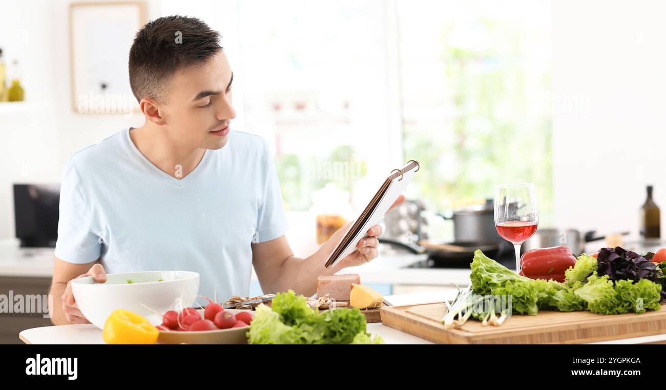 Man reading cook book hi-res stock photography and images - Alamy