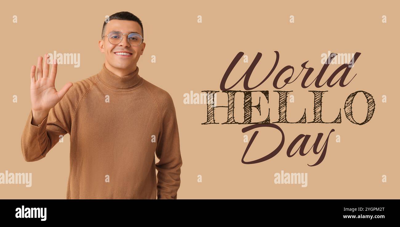 Banner for World Hello Day with young man waving hand on brown ...