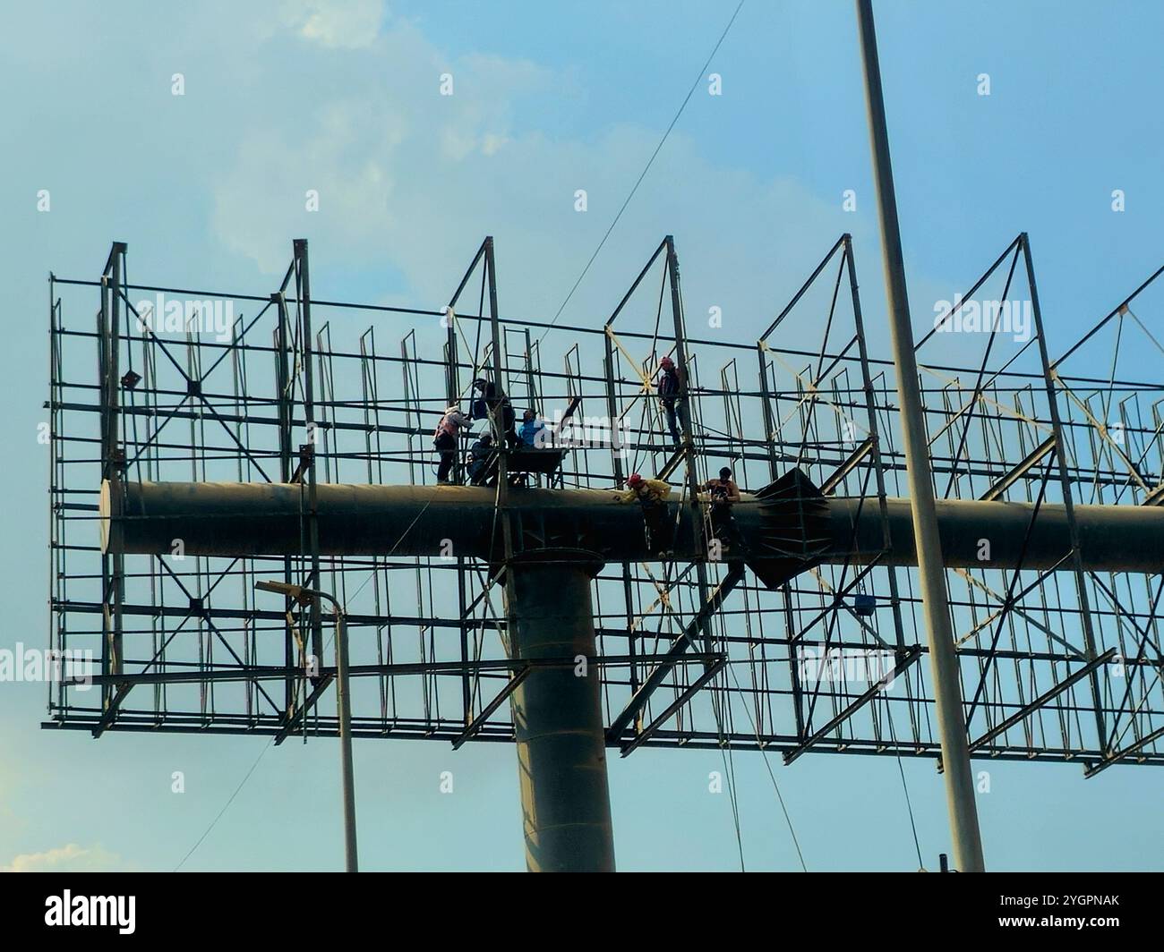 Cairo, Egypt, November 4 2024: installation of a metal sign board with ...