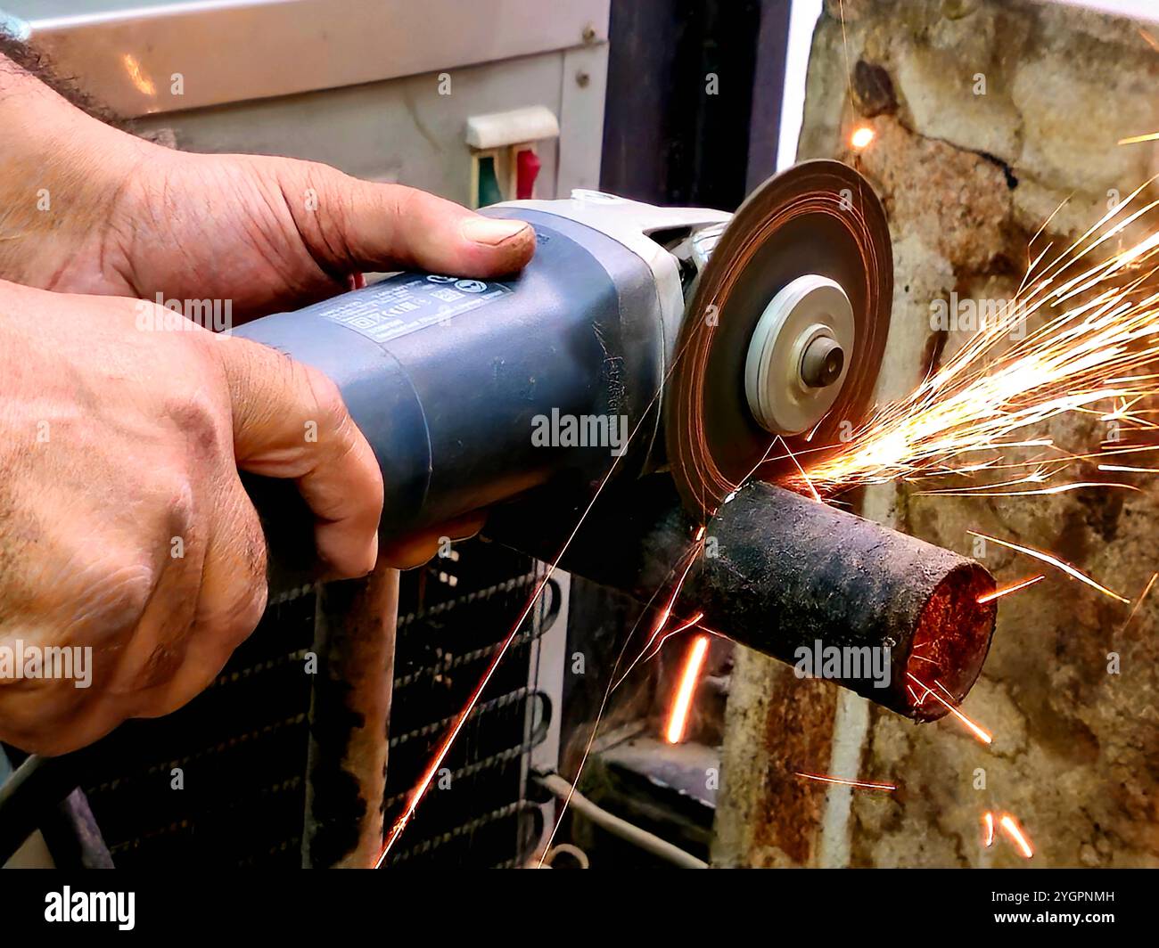 Cairo, Egypt, October 15 2024: angle side disc grinder cutting steel ...