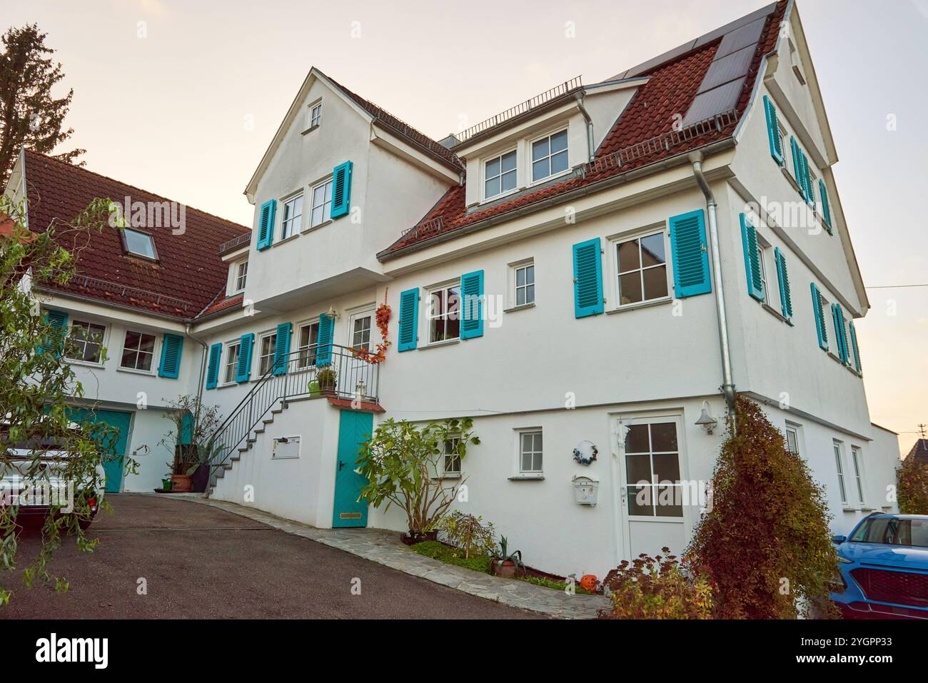 Charming Traditional German Townhouse with Vibrant Turquoise Shutters ...