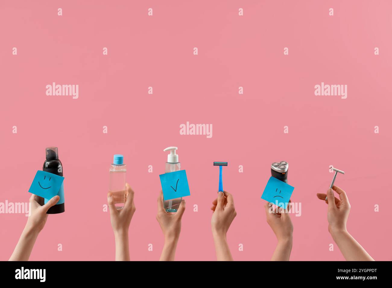 Female hands with electric shaver, bottles of cosmetic products, sticky ...