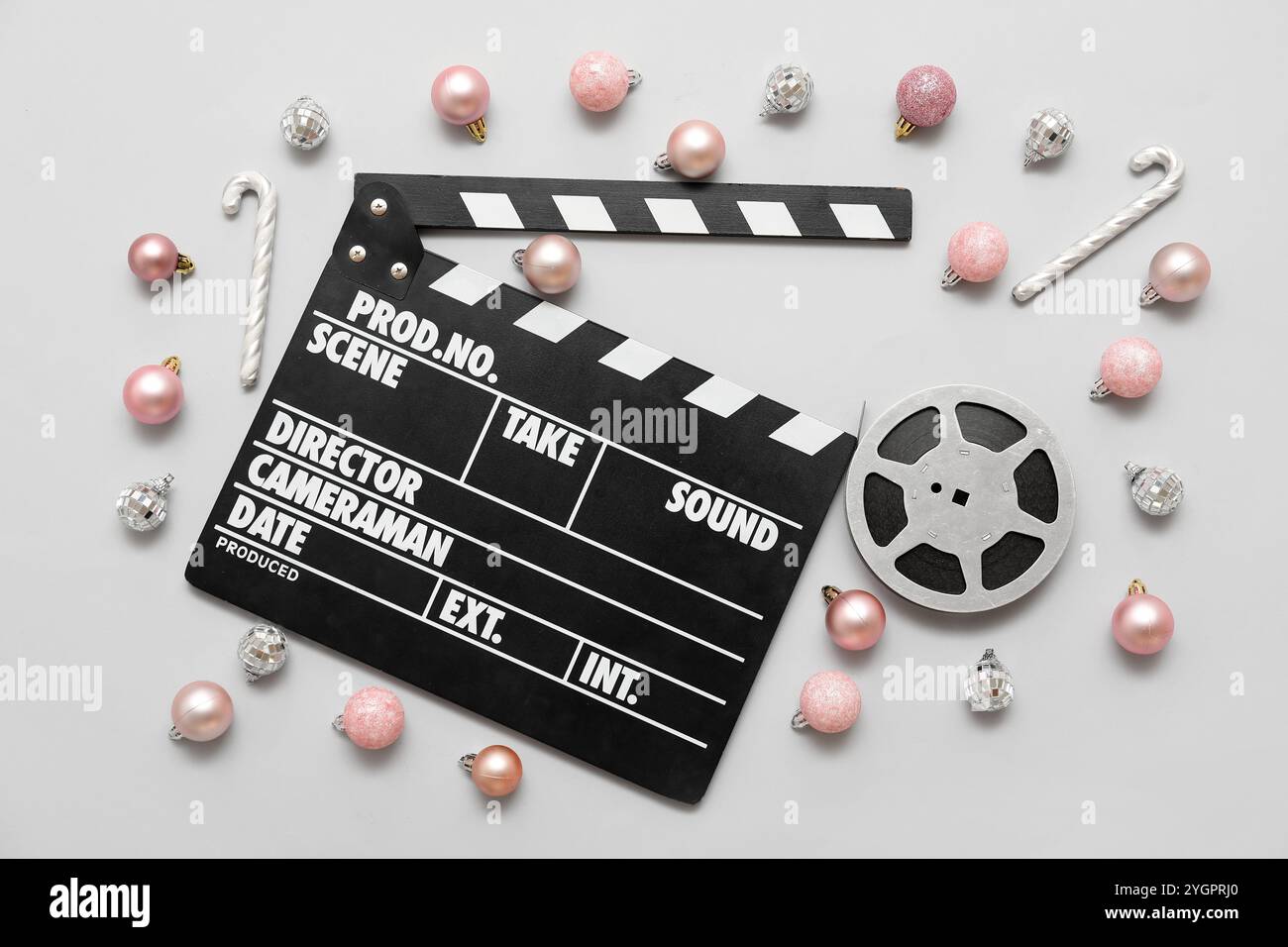 Composition with movie clapper, film reel and Christmas decorations on ...