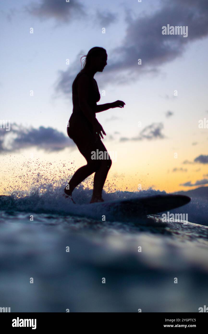 Female surfer rides wave in hi-res stock photography and images - Alamy