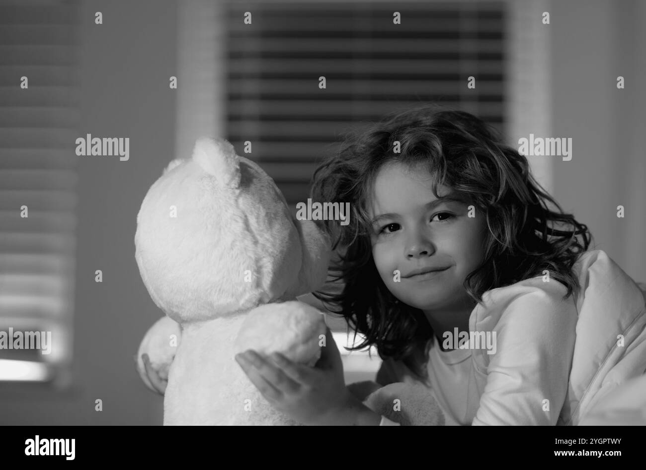 Child play with toy teddy bear. Child enjoys night sllep. Kid asleep ...