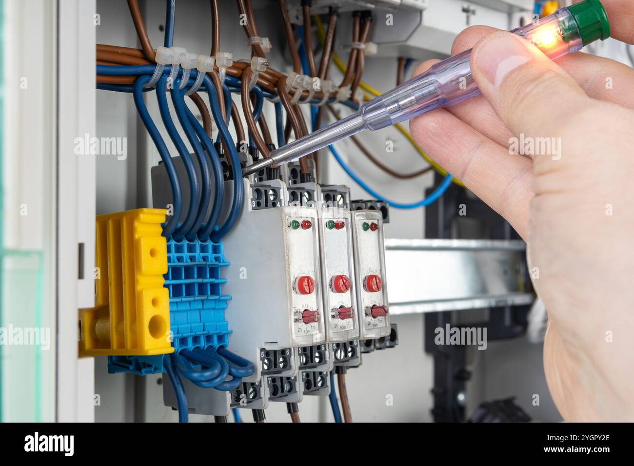 Hand Using Voltage Tester on Electrical Connections Stock Photo - Alamy