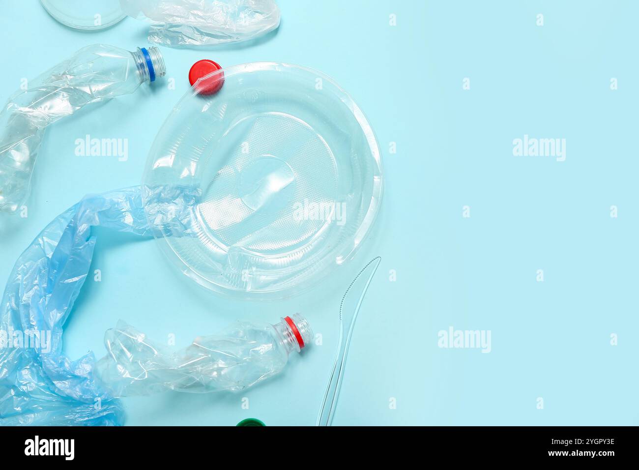 Used plastic on blue background. Microplastic Awareness Month Stock ...