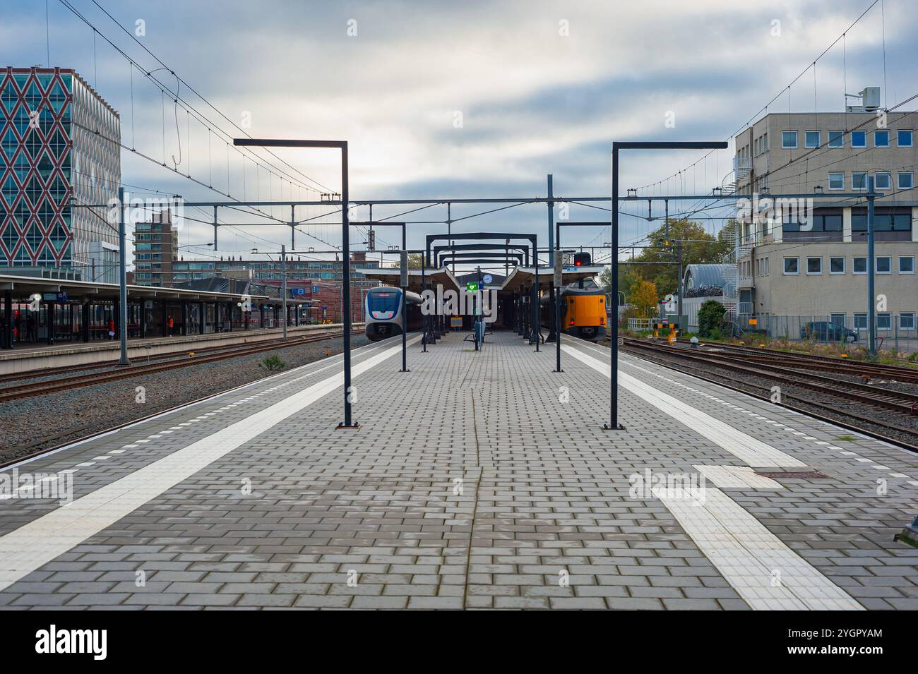 Converging platform and railroad tracks at Gouda train station, The ...