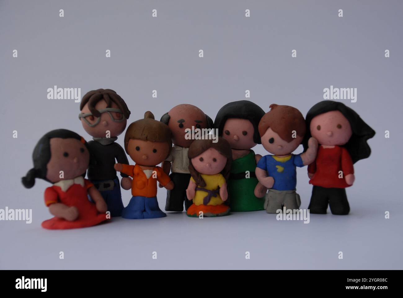 3D rendering in stylized clay of a group of people of different ages ...