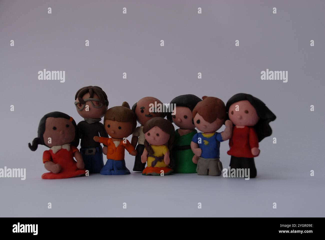 3D rendering in stylized clay of a group of people of different ages ...