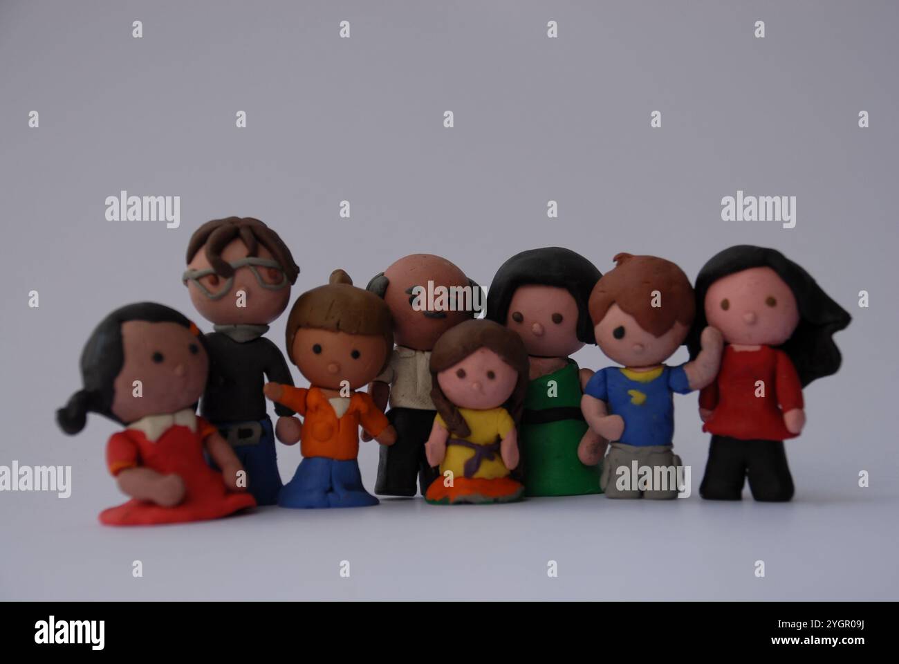 3D rendering in stylized clay of a group of people of different ages ...