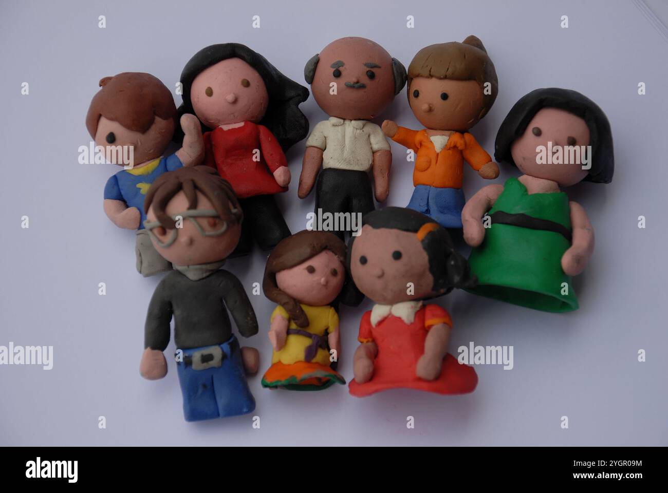 3D rendering in stylized clay of a group of people of different ages ...