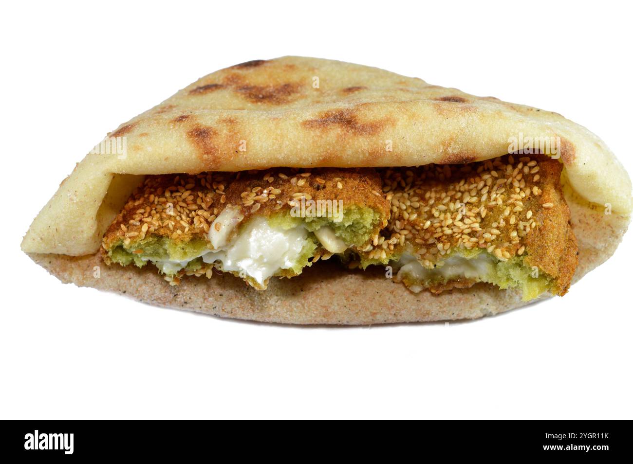 Traditional Egyptian flat bread filled with fried falafel balls, green ...