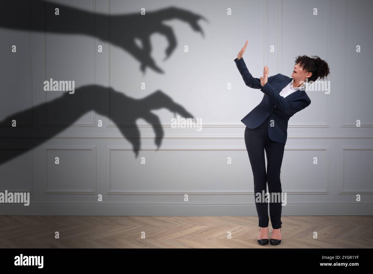 Businesswoman scared by hands of monster reaching for her. Creepy ...