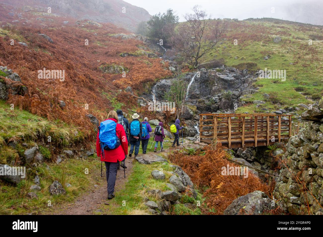 Walking group of walkers backpacking and walking in the Lake District ...
