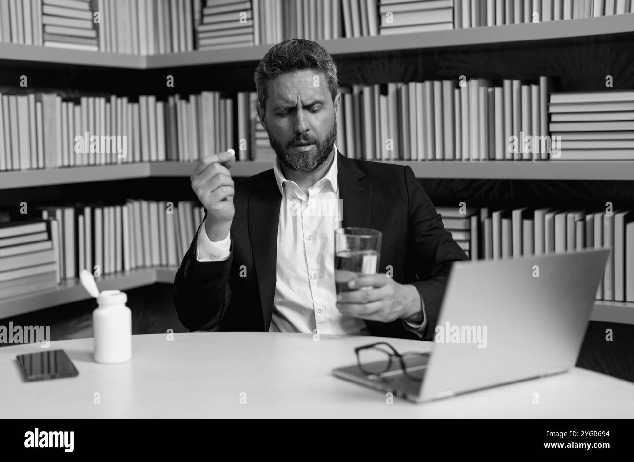 Headache and eye strain on laptop. Business man with stress and fatigue ...