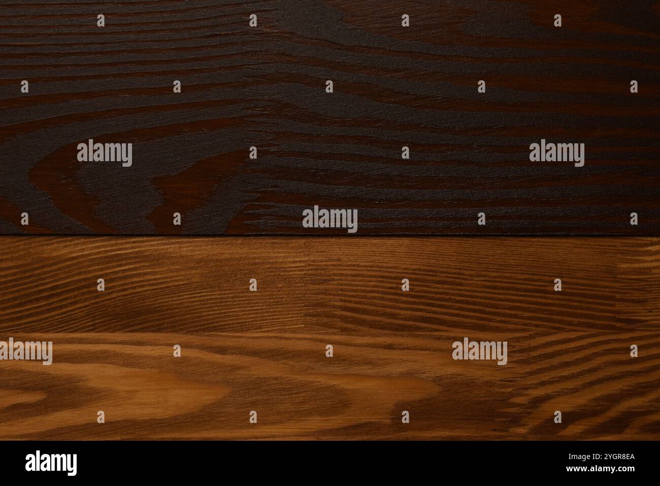 Applying walnut wood stain. Texture of wooden surface as background ...