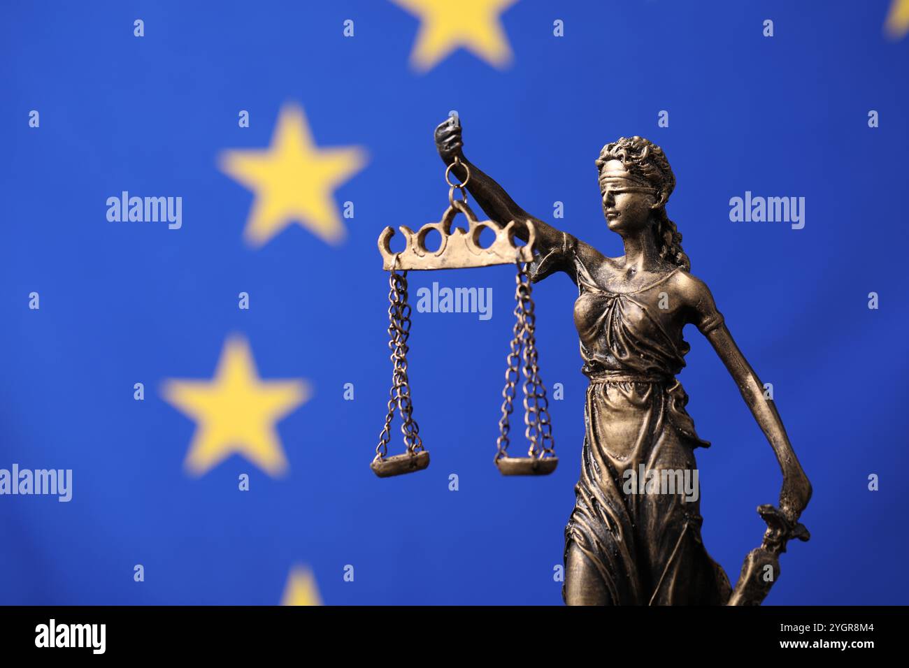 Figure of Lady Justice against European Union flag. Space for text ...