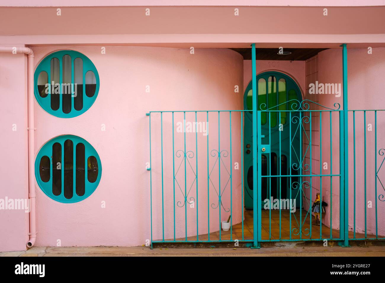 Pink and Green apartment building facade Stock Photo - Alamy