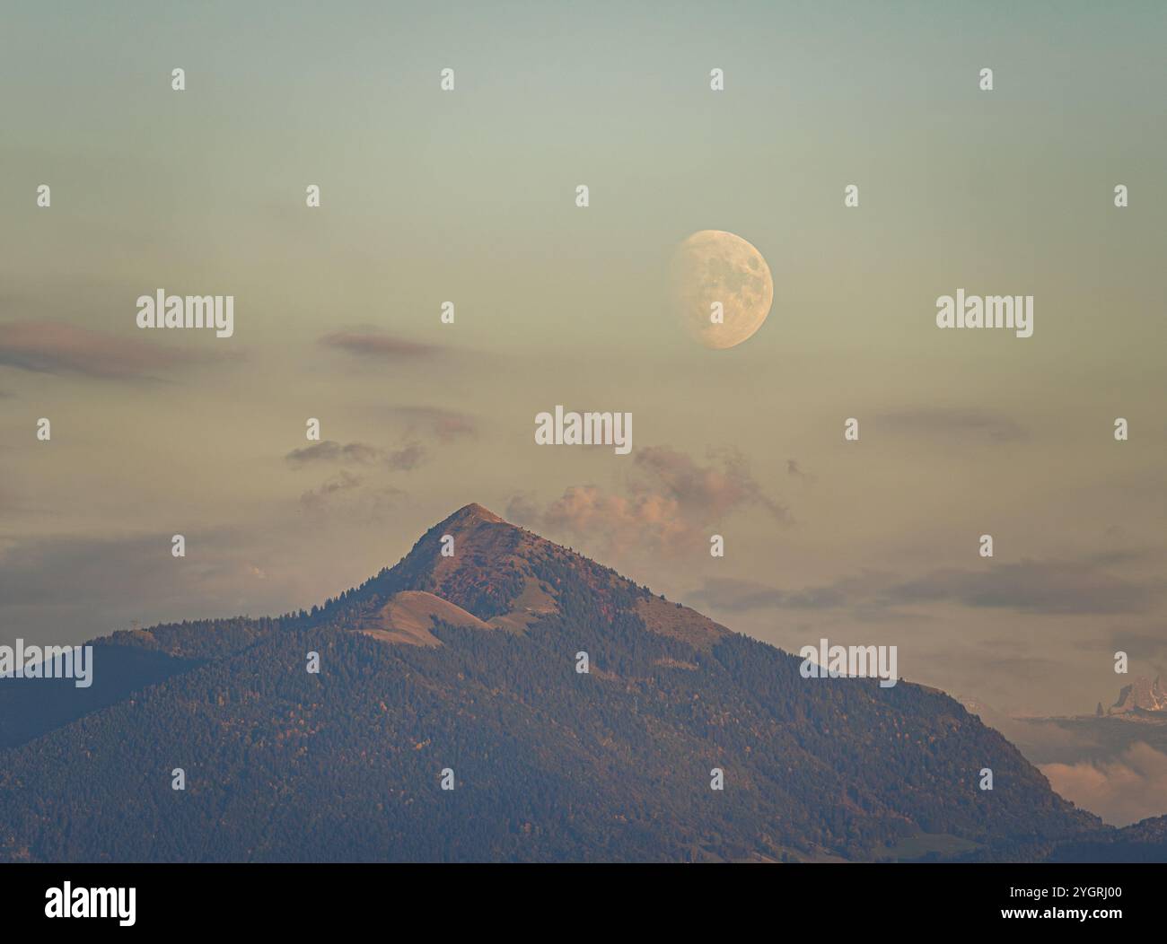 The nearly full moon rising behind Mount Le Mole Stock Photo - Alamy