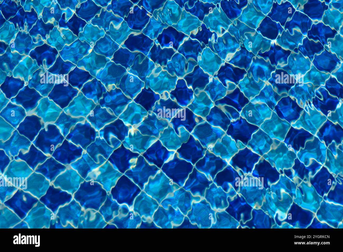 Bright blue tiles gleam under the sunlight, creating a tranquil water ...