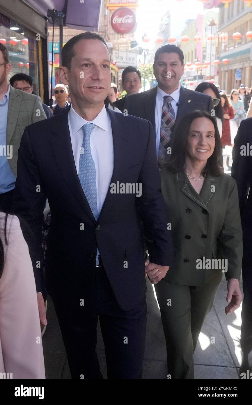 Daniel Lurie, left, tours businesses in Chinatown with his wife, Becca ...