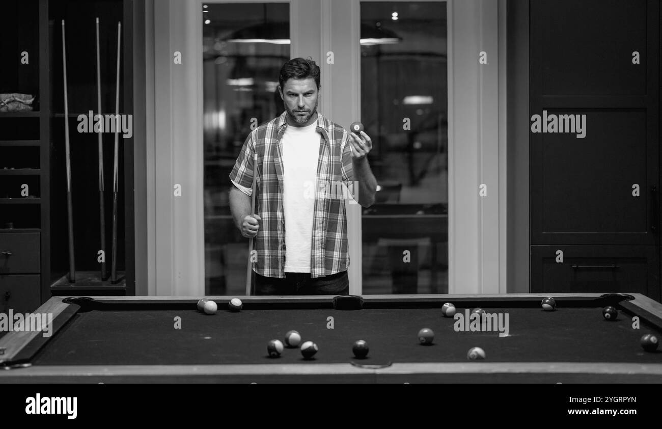 Man playing billiards in the billiard club Stock Photo - Alamy
