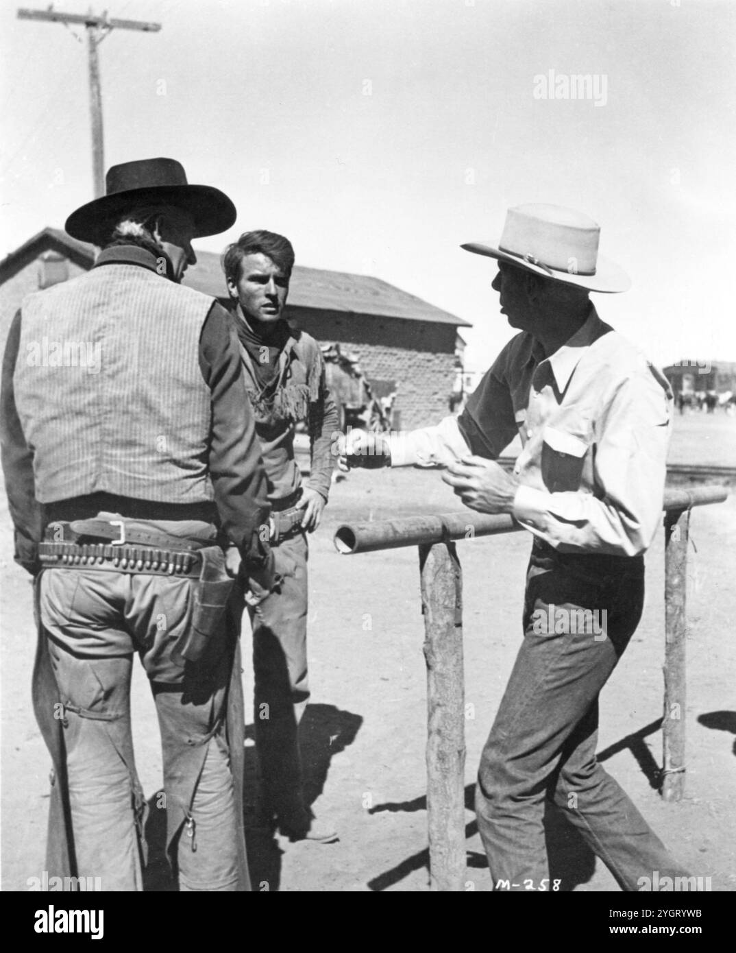 JOHN WAYNE, MONTGOMERY CLIFT and HOWARD HAWKS on the set of RED RIVER ...