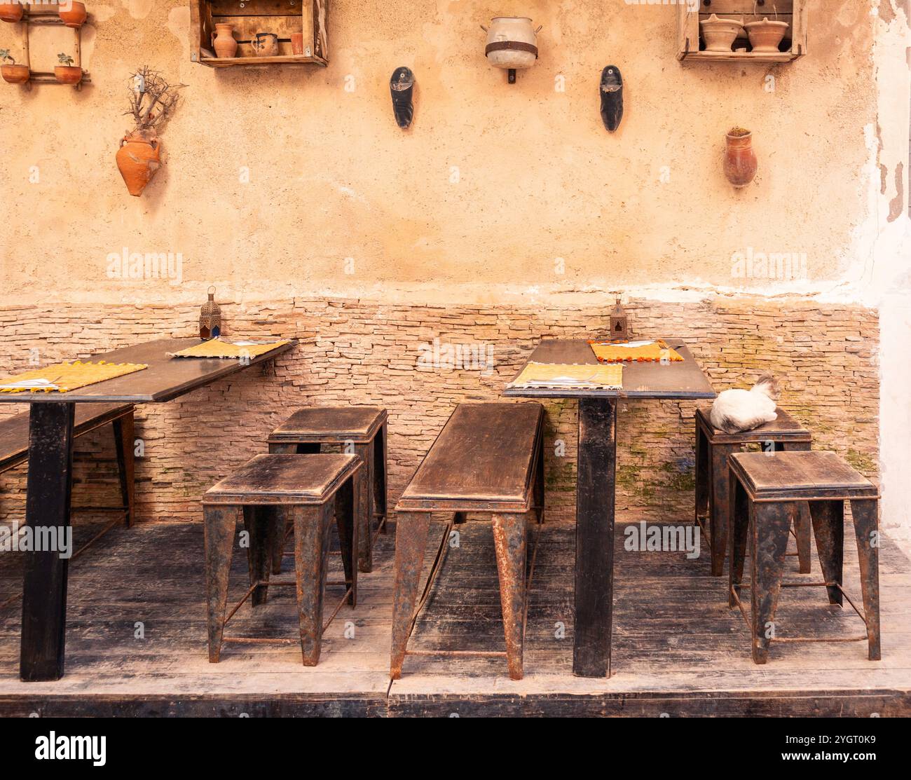 Rustic charm outdoor cafe restaurant on a quiet street in essaouira ...
