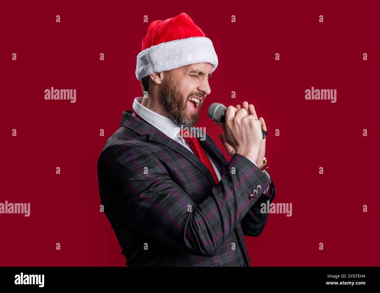 cheerful event host man singing with microphone. merry christmas. event ...