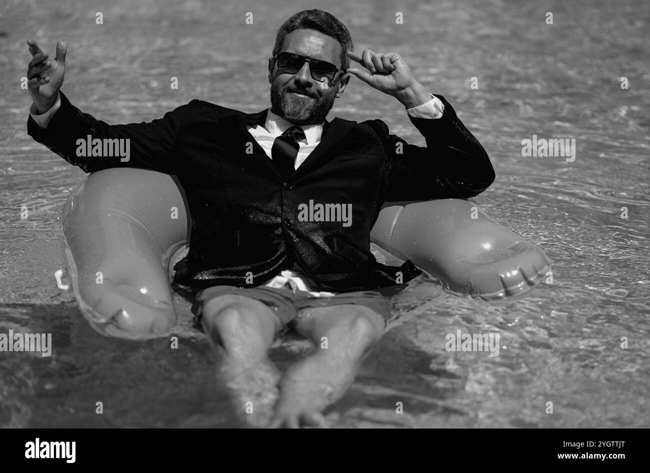 Businessman working summer beach Black and White Stock Photos & Images ...