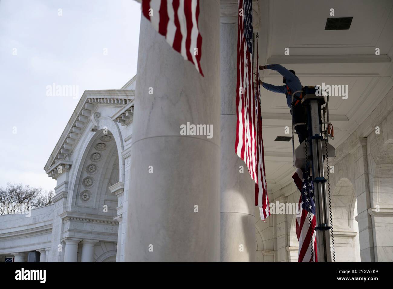 Arlington National Cemetery Facilities Maintenance employees hang U.S ...