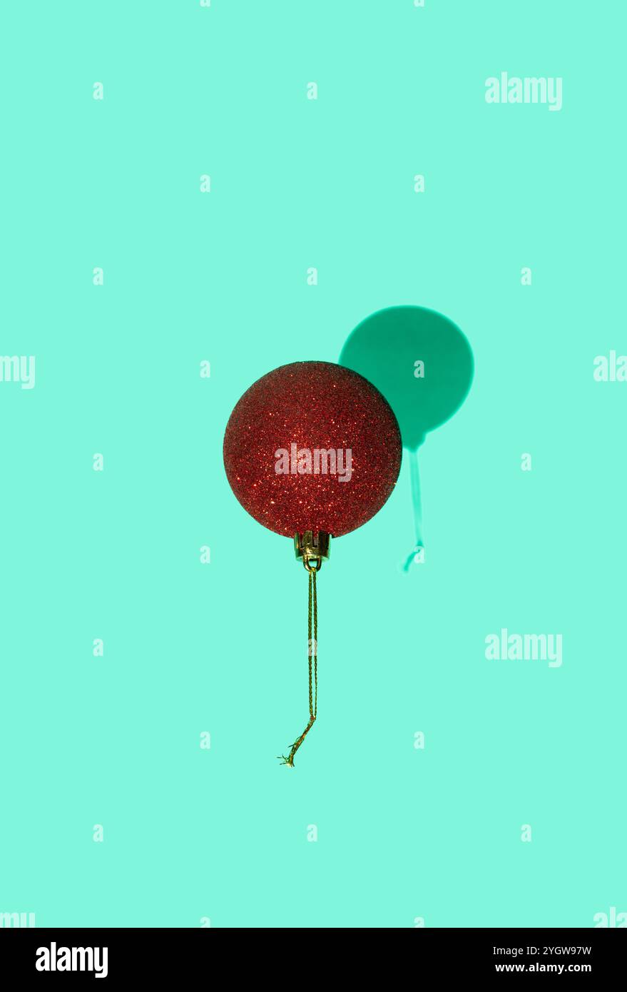 Christmas red glitter ballon on vibrant blue background. Minimal ...