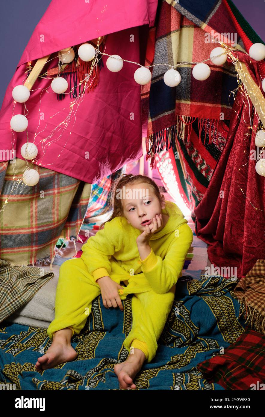 Little girl in tent sleepover. Kids home. Having fun in children room ...