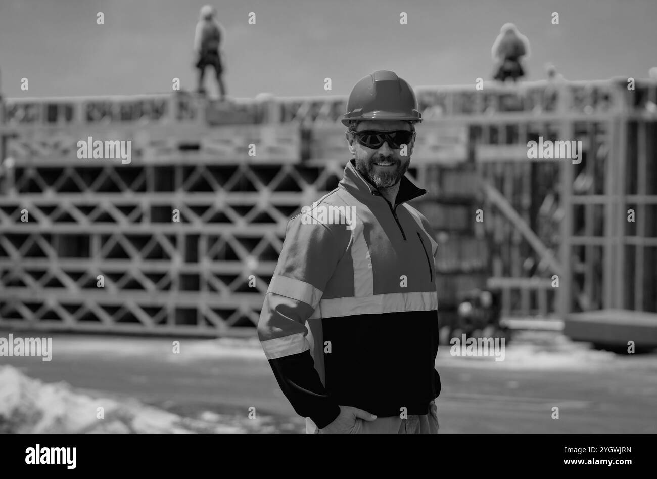 Portrait confident foreman in hard hat at new house under construction ...