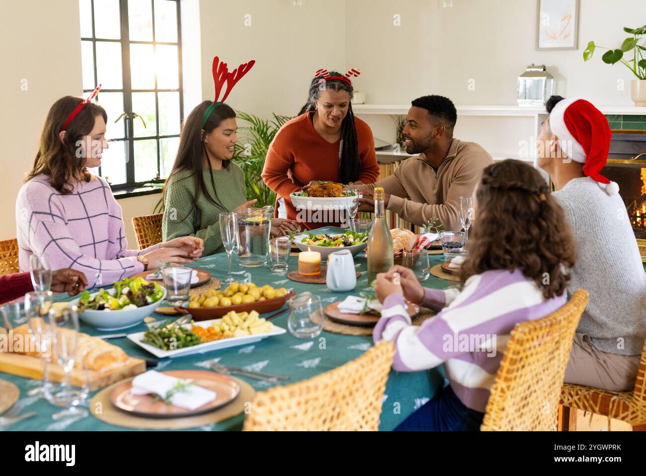 Multiracial family celebrating christmas dinner together, at home Stock ...