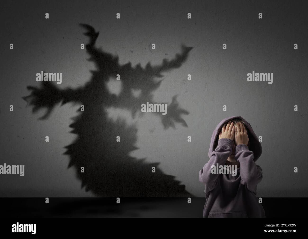 Little kid scared by monster. Spooky shadow on grey wall Stock Photo ...