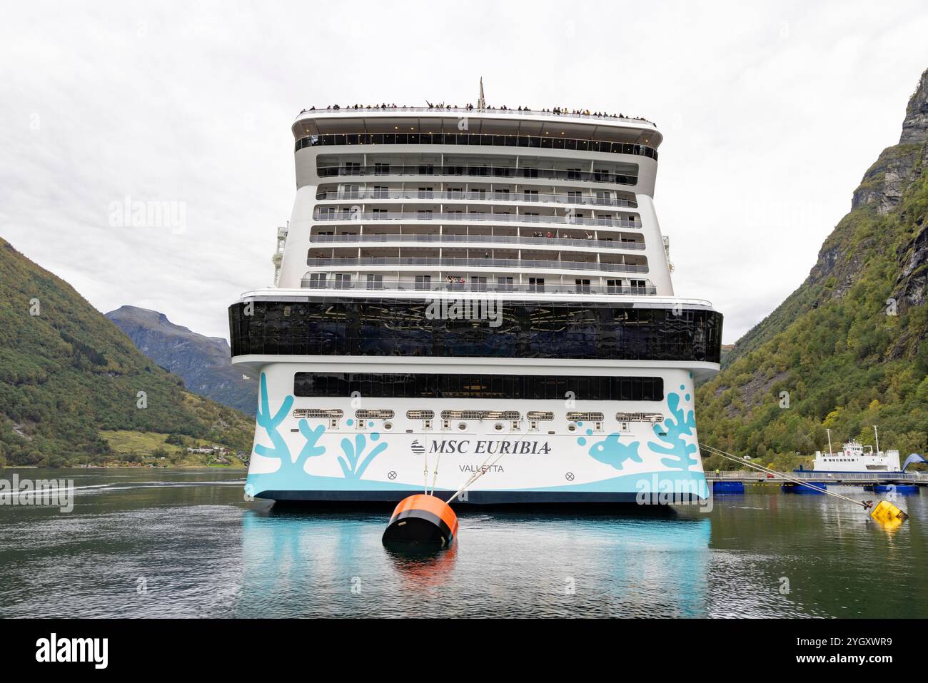 MSC Euribia cruise ship in port at the norwegian village of Geiranger ...