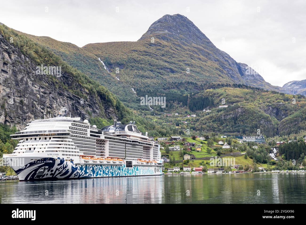 MSC Euribia cruise ship in port at the norwegian village of Geiranger ...