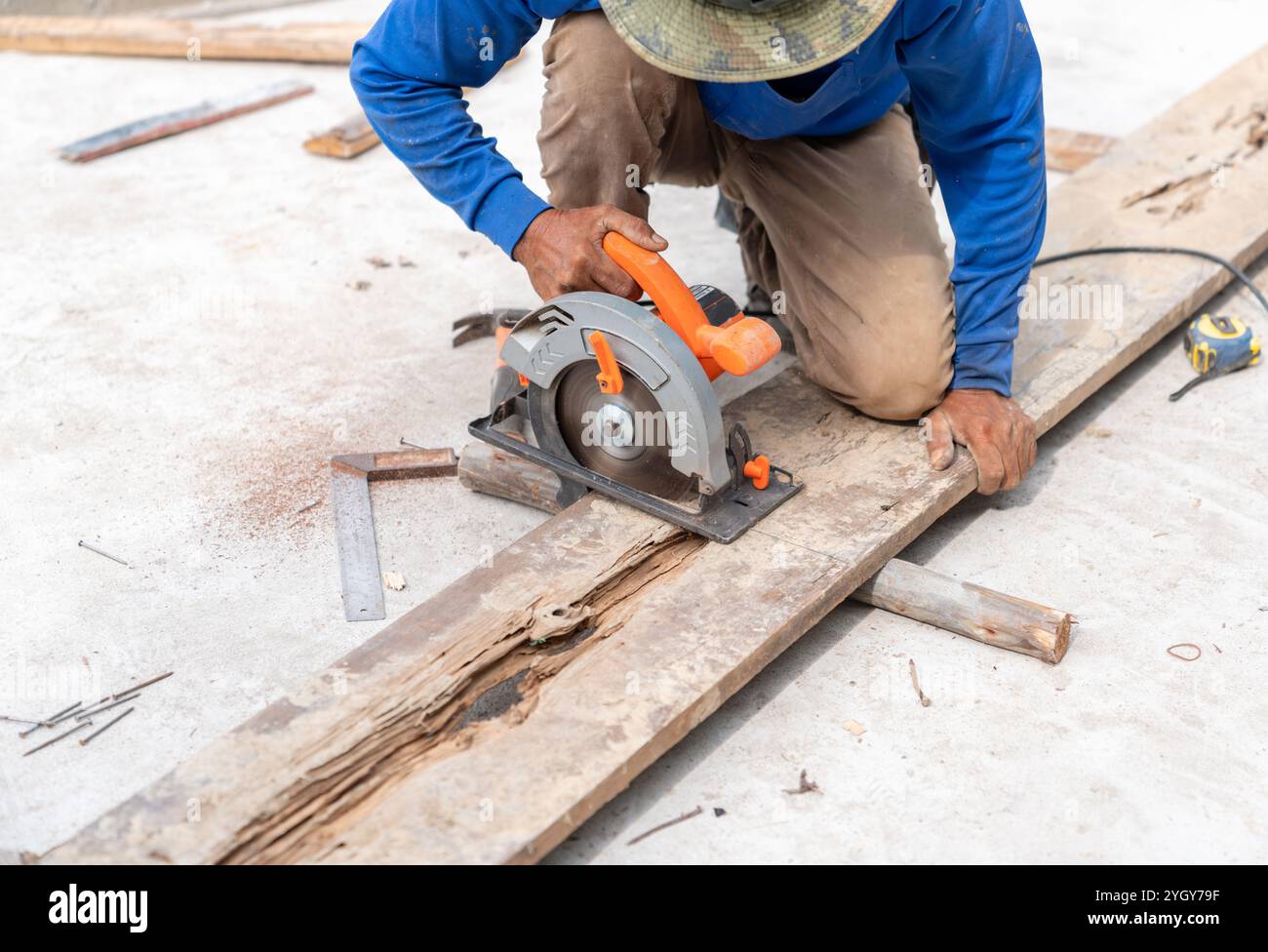 The carpenter being used Circular saw Saw to cut the sheet wood in ...