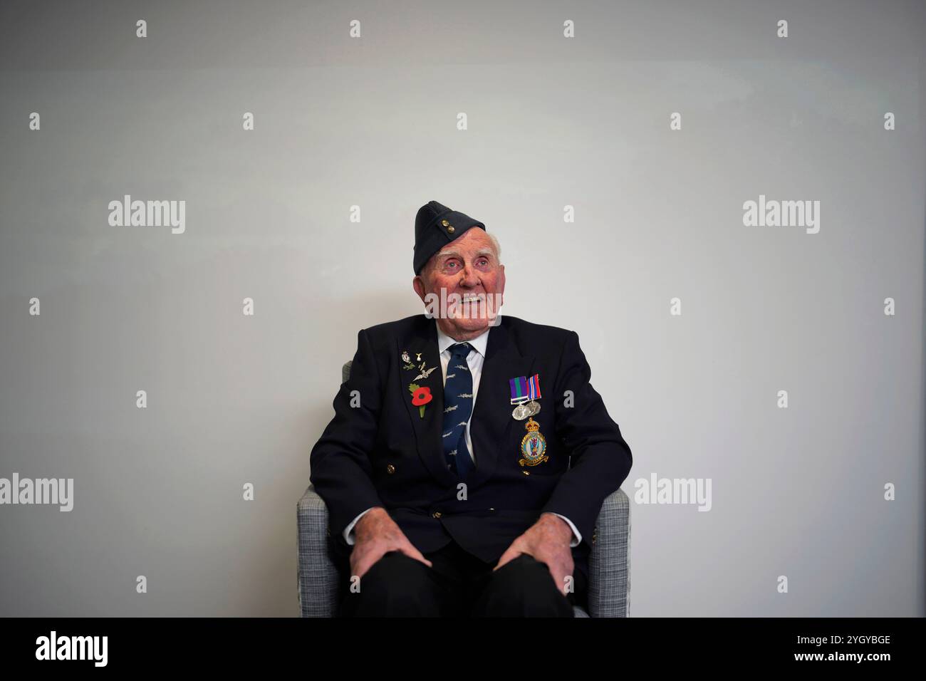 Michael Woods, 100-year-old World War II veteran, poses for a photograph during an interview in ...