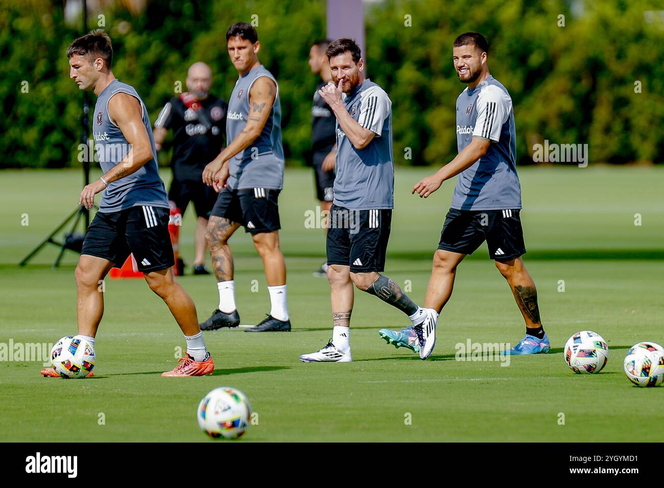 Argentine forward #10 Lionel Messi (R) trains with teammates at the ...
