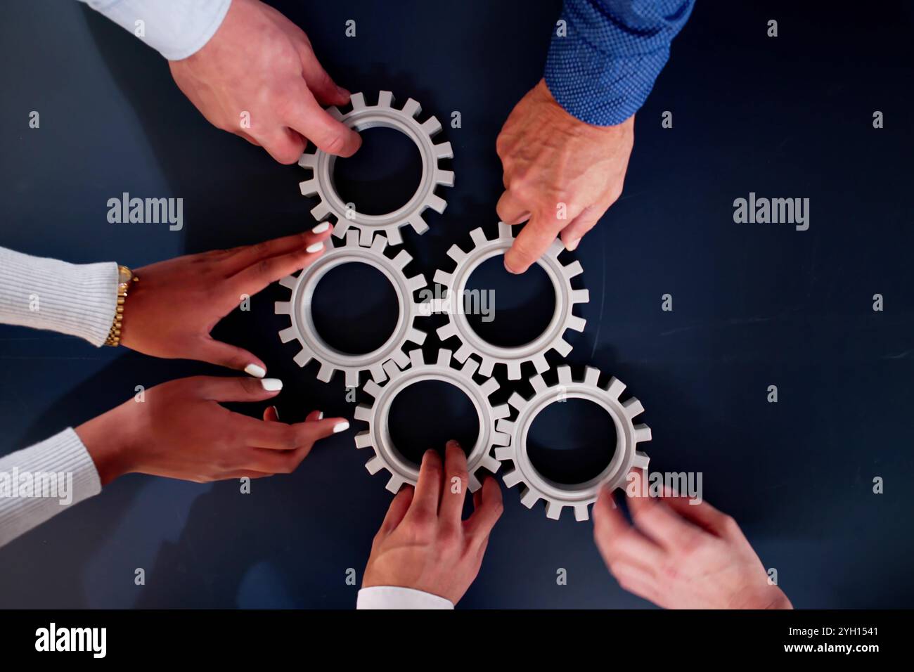 Diverse People Hands Holding Gear Wheels. Business Partnership Stock ...