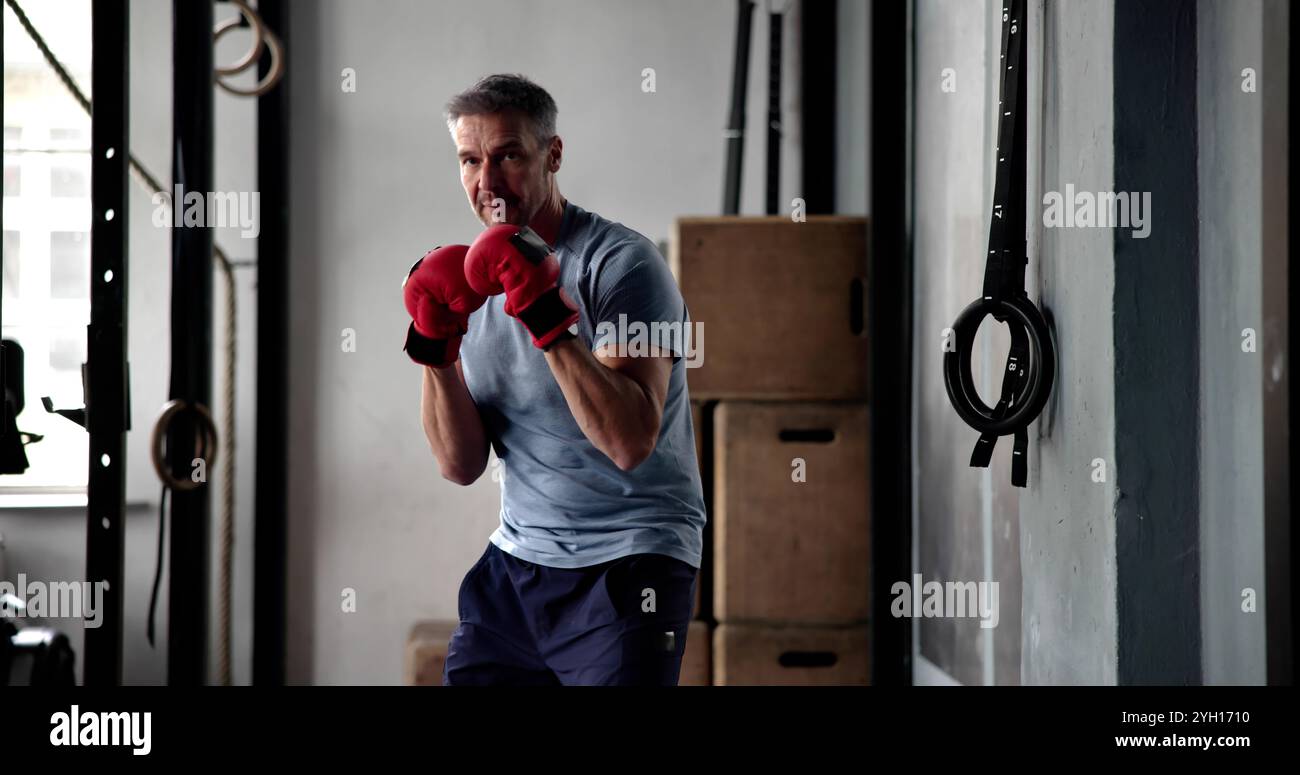 Man Power Boxing In Gym. Doing Kick Training Exercise Stock Photo - Alamy