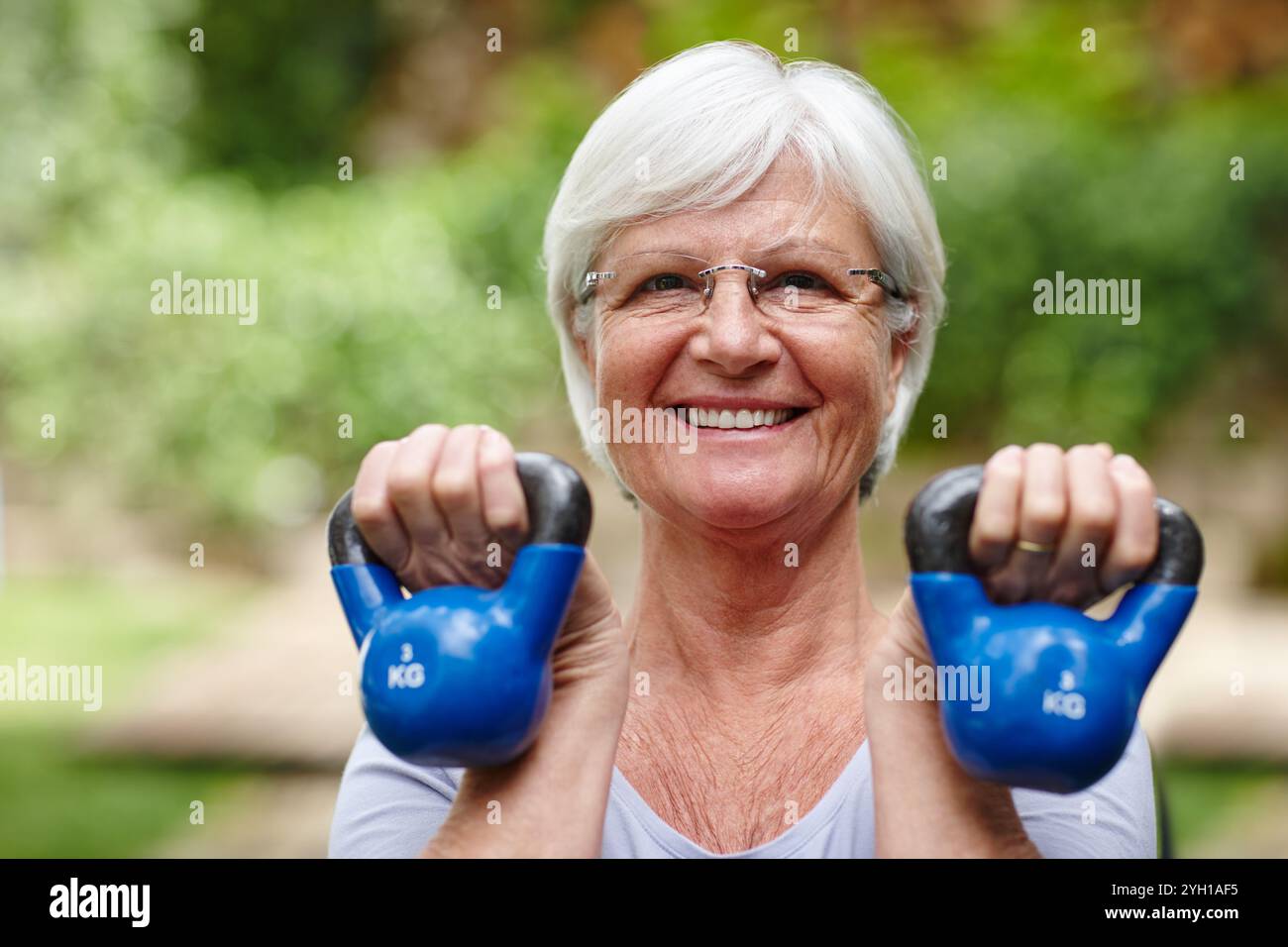 Old woman, kettlebell and outdoor workout in portrait, exercise and ...