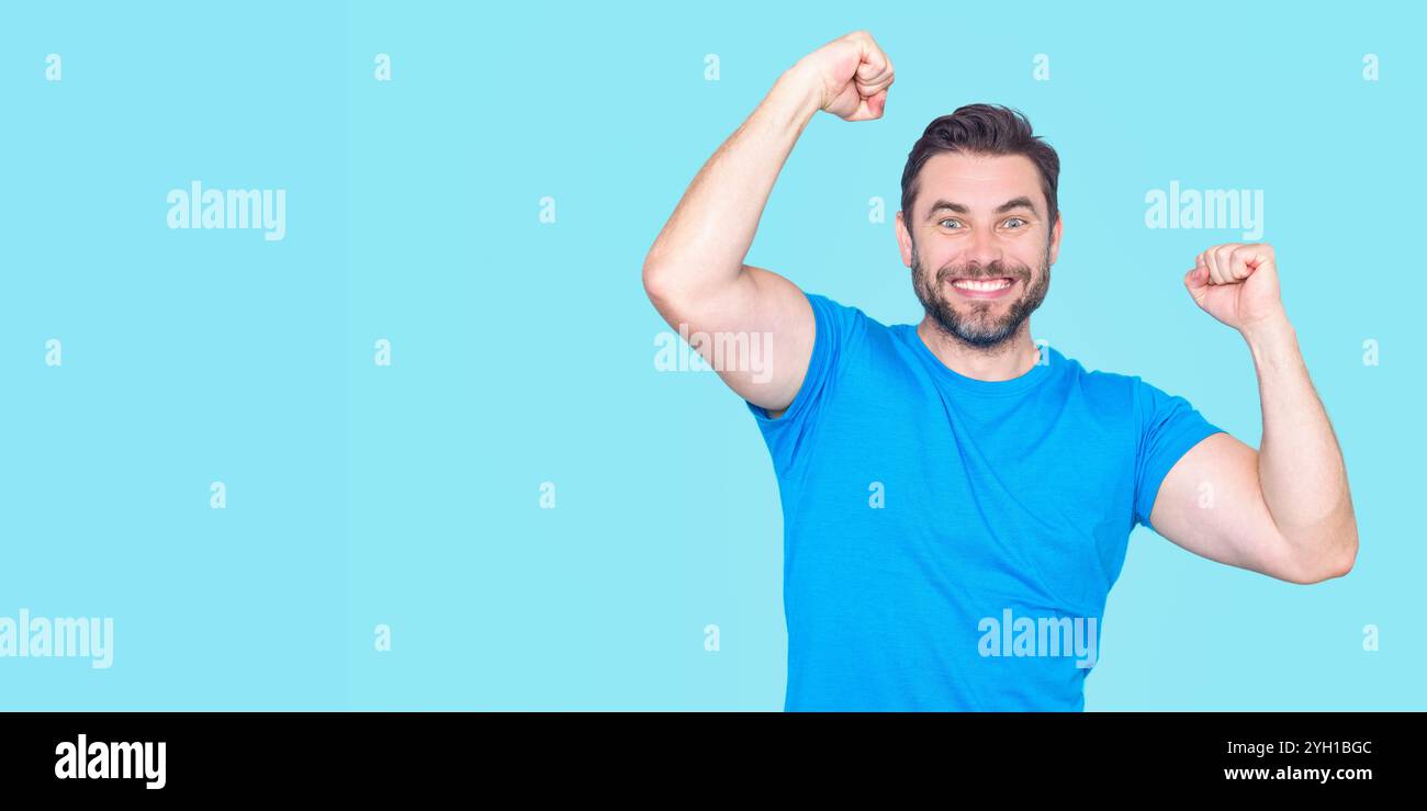 The winner. Successful man raising arms. Excited man with arms up ...