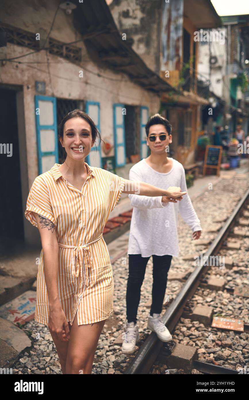 Couple walking on a train track hi-res stock photography and images - Alamy