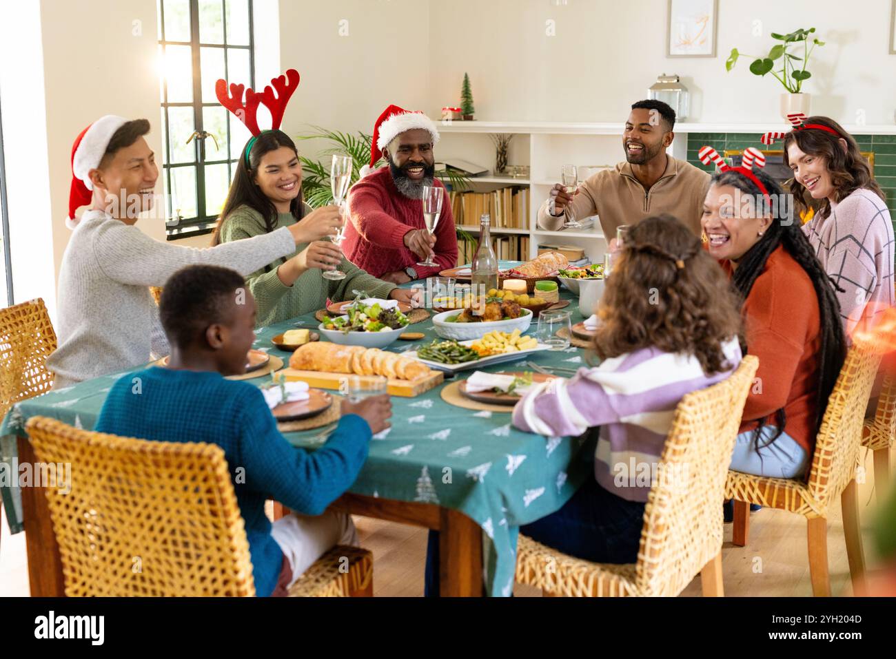 Multiracial family celebrating christmas dinner together, at home Stock ...